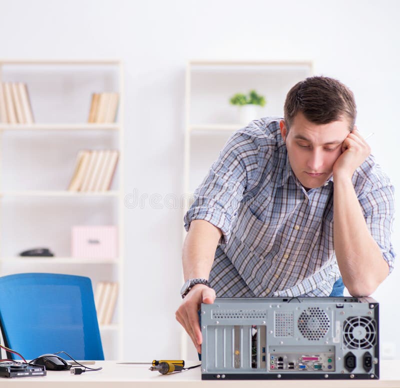 Young Technician Repairing Computer in Workshop Stock Photo - Image of ...