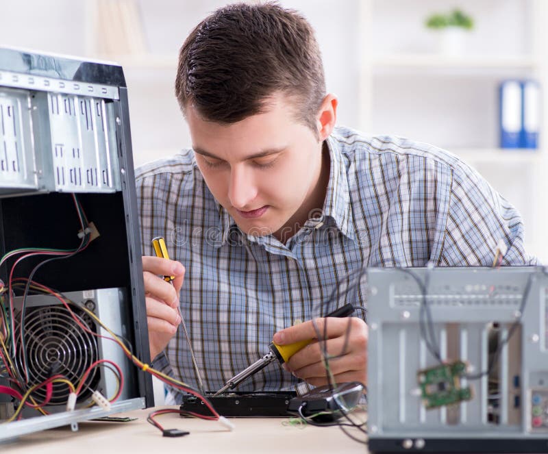 Young Technician Repairing Computer in Workshop Stock Photo - Image of ...