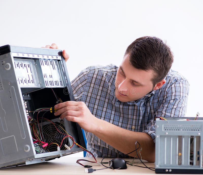 Young Technician Repairing Computer in Workshop Stock Photo - Image of ...