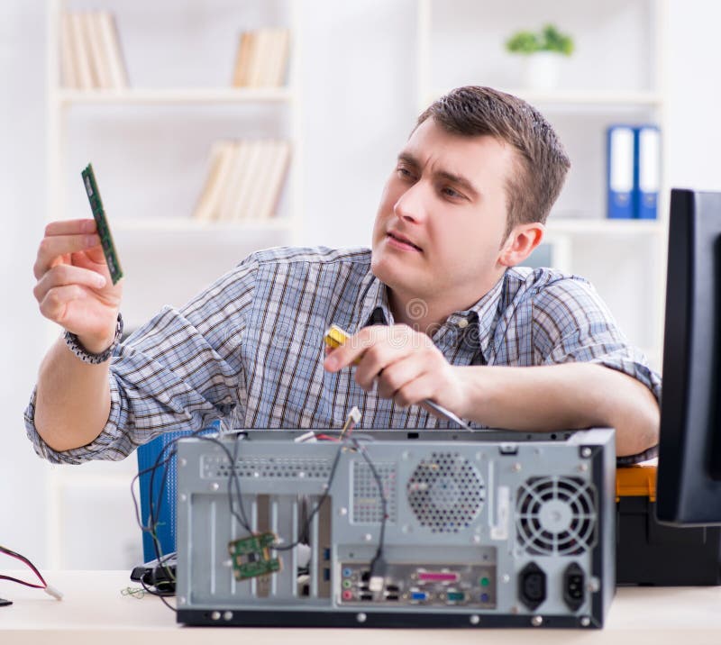 Young Technician Repairing Computer in Workshop Stock Image - Image of ...