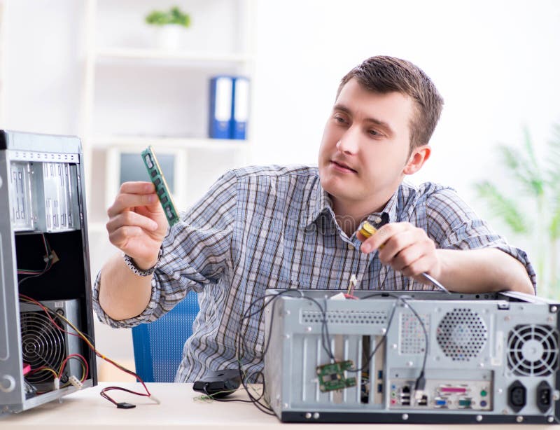Young Technician Repairing Computer in Workshop Stock Image - Image of ...