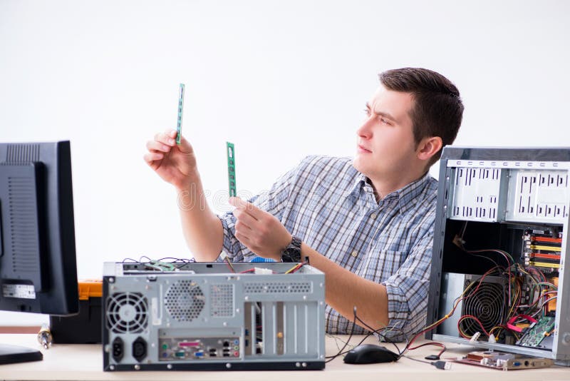 The Young Technician Repairing Computer in Workshop Stock Image - Image ...