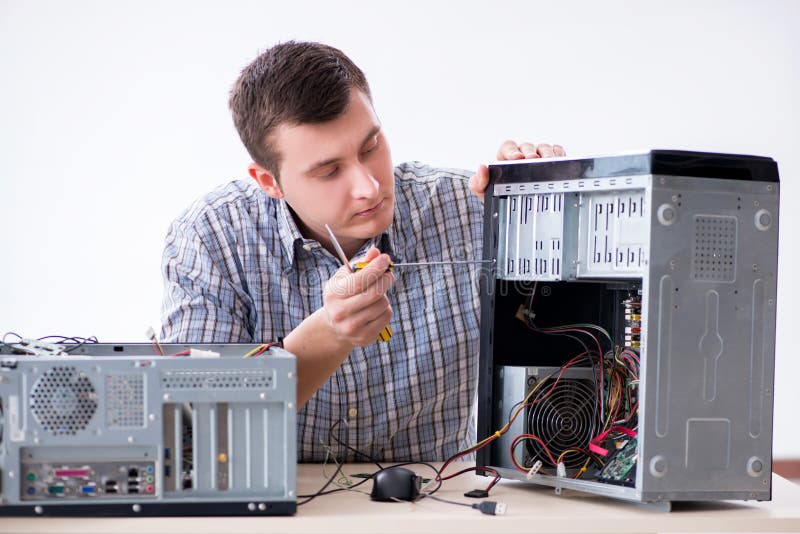 The Young Technician Repairing Computer in Workshop Stock Photo - Image ...