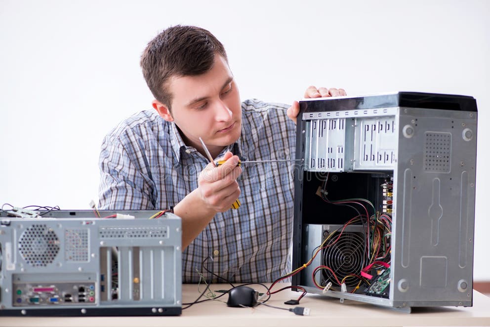 The Young Technician Repairing Computer in Workshop Stock Photo - Image ...
