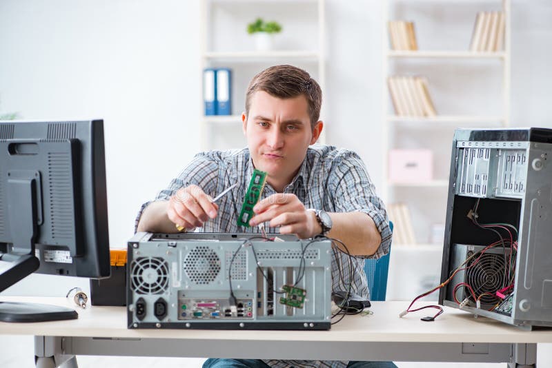 The Young Technician Repairing Computer in Workshop Stock Image - Image ...