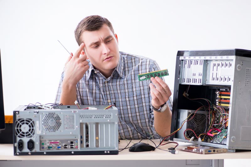 The Young Technician Repairing Computer in Workshop Stock Image - Image ...