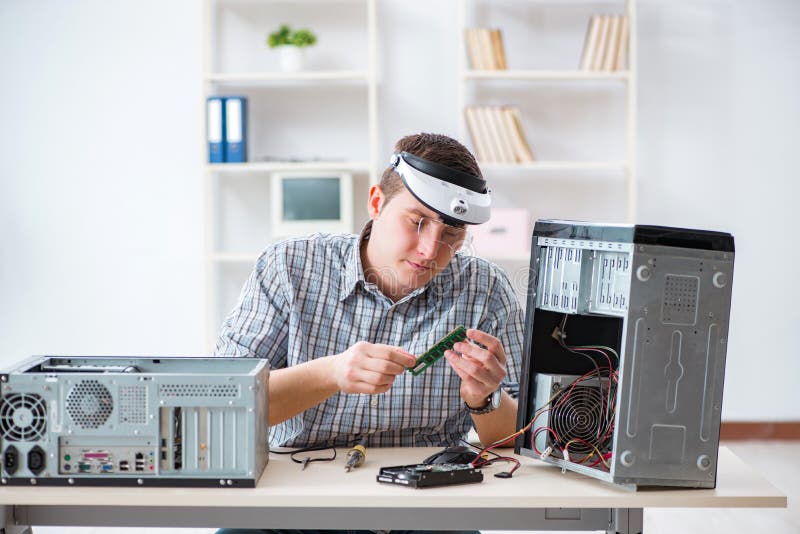 The Young Technician Repairing Computer in Workshop Stock Image - Image ...