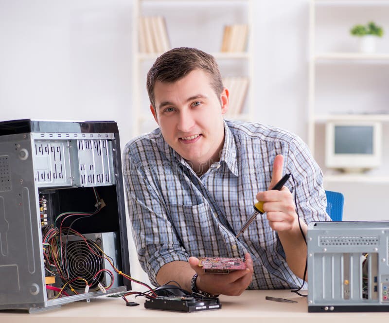 Young Technician Repairing Computer in Workshop Stock Image - Image of ...