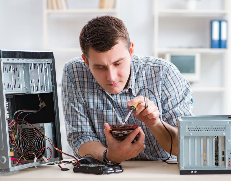 Young Technician Repairing Computer in Workshop Stock Photo - Image of ...
