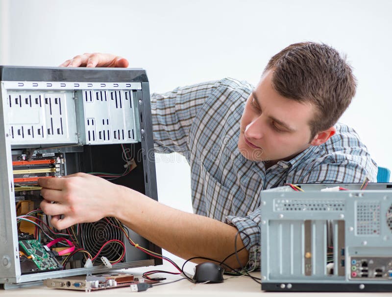 Young Technician Repairing Computer in Workshop Stock Image - Image of ...