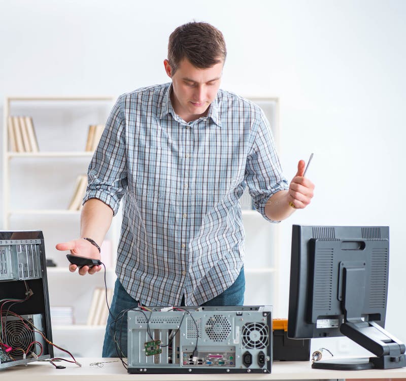 Young Technician Repairing Computer in Workshop Stock Image - Image of ...