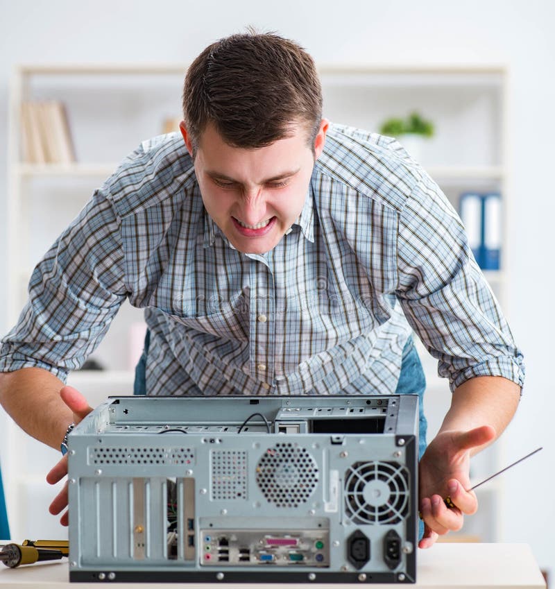 Young Technician Repairing Computer in Workshop Stock Photo - Image of ...