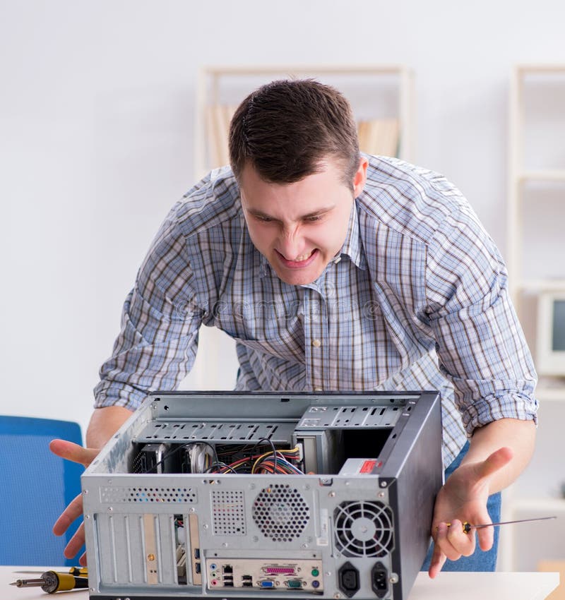Young Technician Repairing Computer in Workshop Stock Image - Image of ...