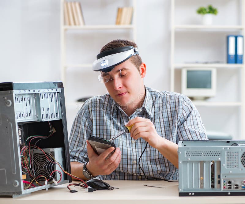 The Young Technician Repairing Computer in Workshop Stock Photo - Image ...