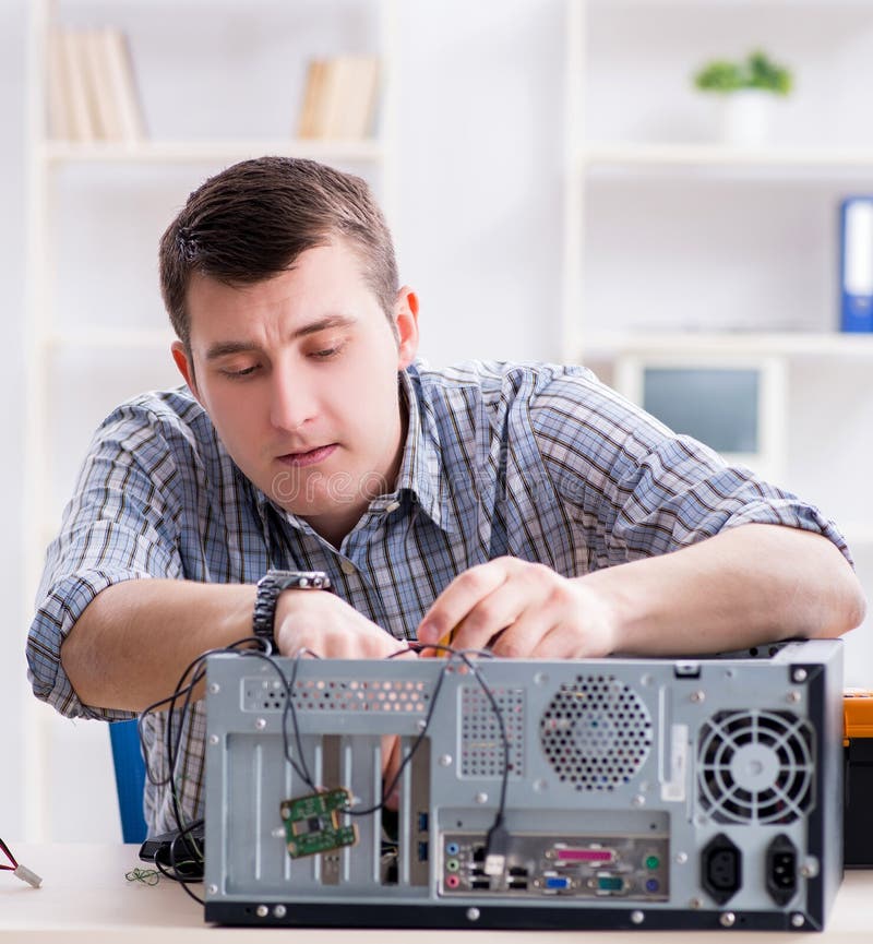 The Young Technician Repairing Computer in Workshop Stock Image - Image ...