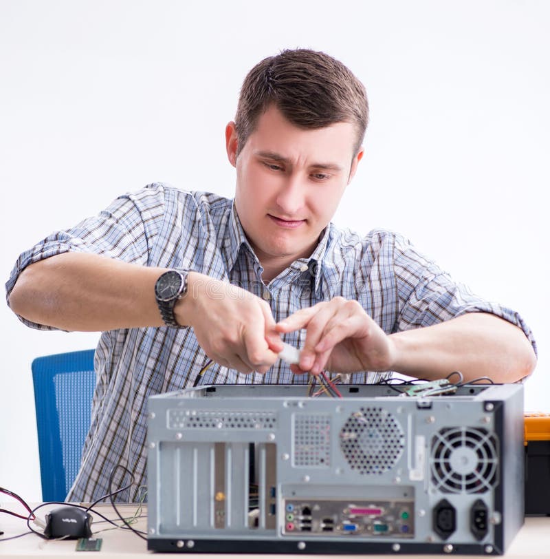 Young Technician Repairing Computer in Workshop Stock Image - Image of ...