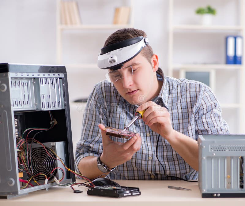 The Young Technician Repairing Computer in Workshop Stock Image - Image ...
