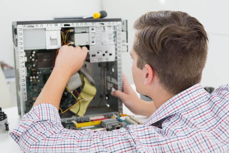 Young Technician Working on Broken Computer Stock Photo - Image of desk ...