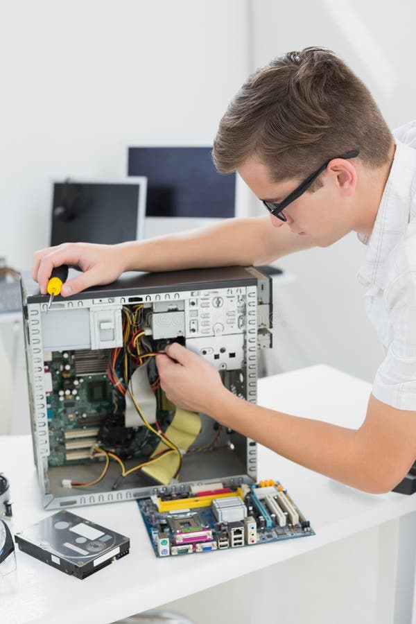Young Technician Working on Broken Computer Stock Photo - Image of ...