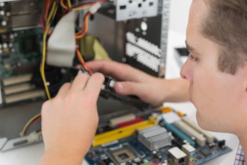 Young Technician Working on Broken Computer Stock Photo - Image of ...