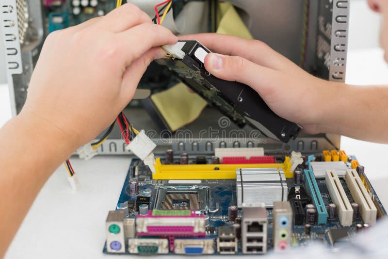 Young Technician Working on Broken Computer Stock Photo - Image of ...