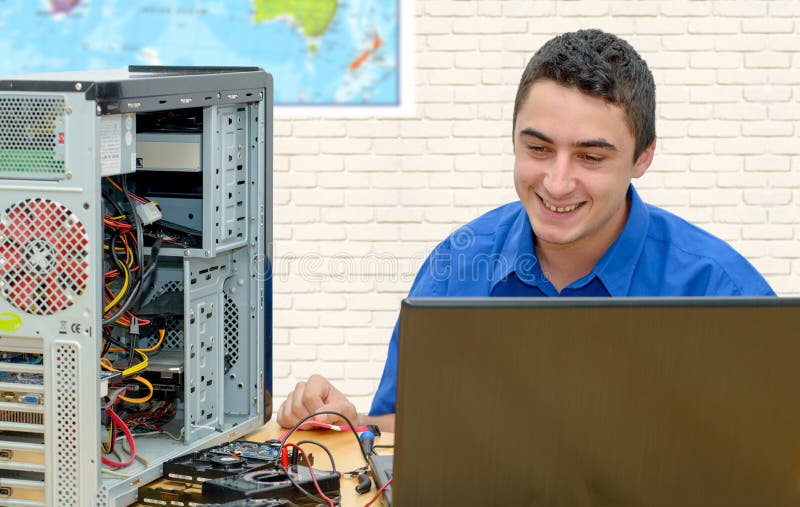 Young Technician Working on Broken Computer in His Office Stock Image ...