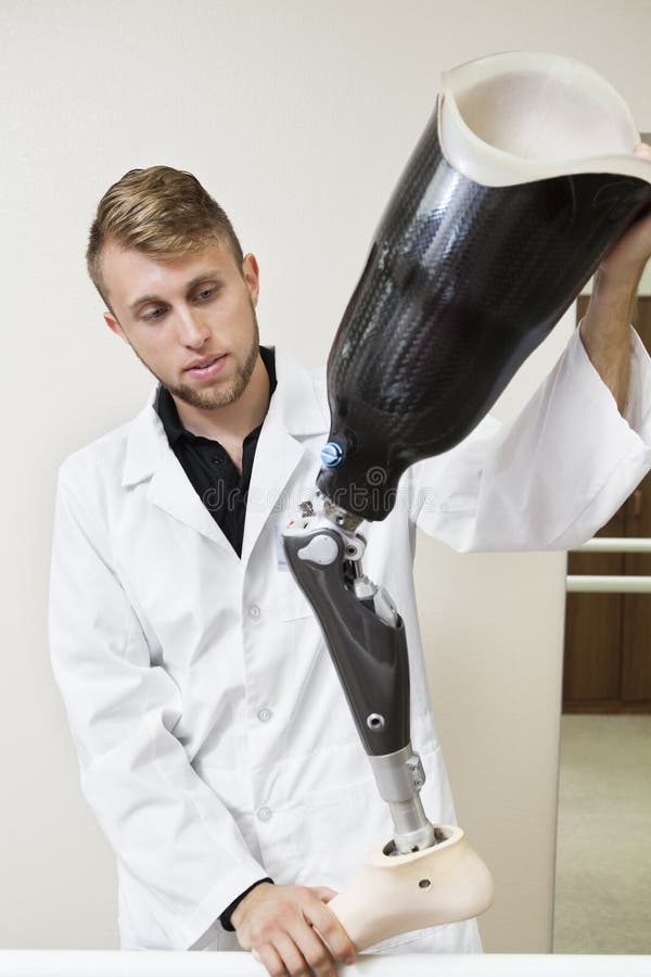 Young Technician Working on Prosthetic Leg Stock Photo - Image of ...