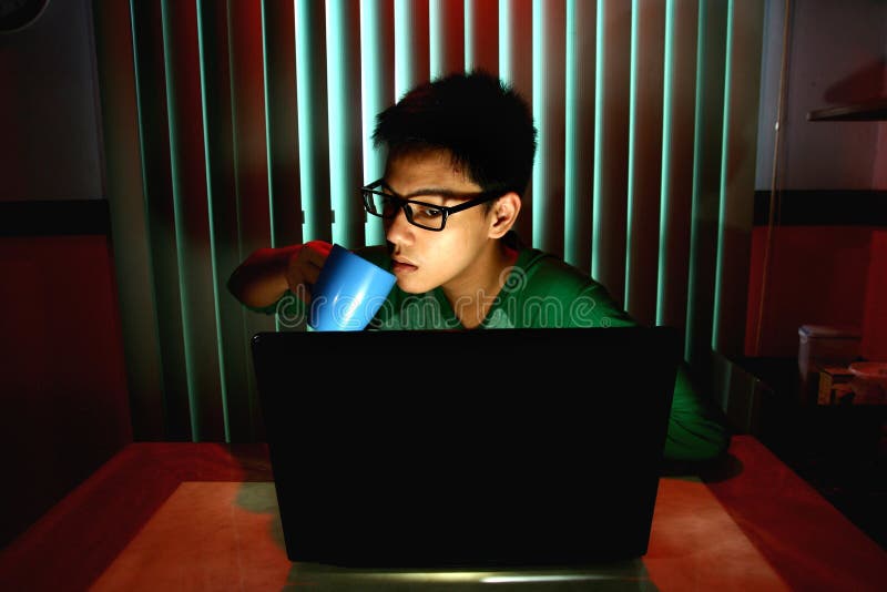Young Teen Drinking Coffee in Front of a Laptop Computer Stock Image ...