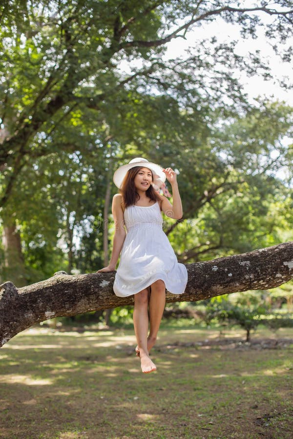 Young Teen Girl Sitting on Tree Stock Photo - Image of beauty, cheerful ...