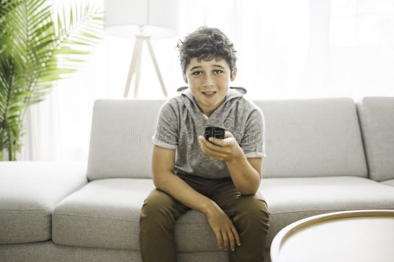 Young Girl Child Sitting Couch Using Remote Control Stock Photos - Free ...