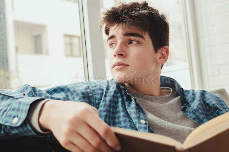 Teenage Boy Reading or Studying at Home Stock Photo - Image of natural ...