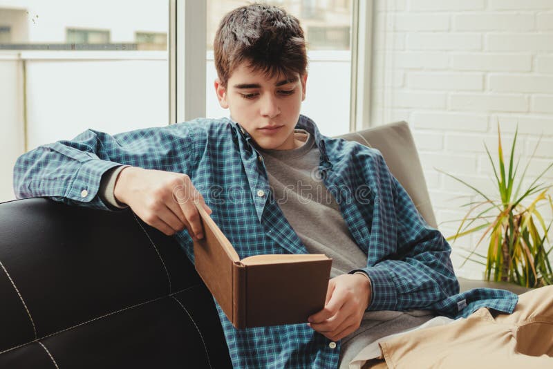 Young Teenage Boy Reading or Studying Stock Image - Image of paper ...