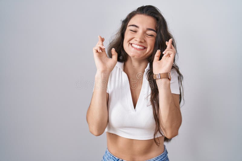 Young Teenager Girl Studying Using Computer Laptop Doing Ok Sign with ... Young Teenager Girl Studying Using Computer Laptop Doing Ok Sign with ...