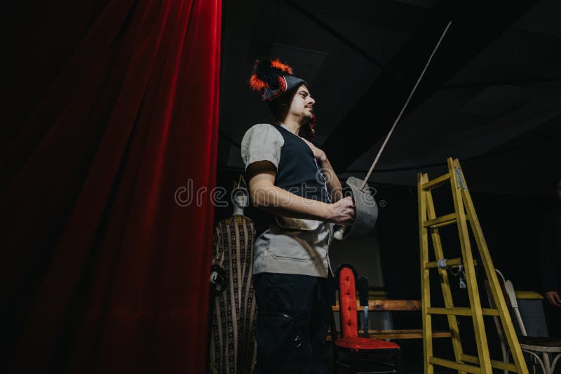 Young Actor Preparing for Rehearsal on a Theater Stage with Props and ...