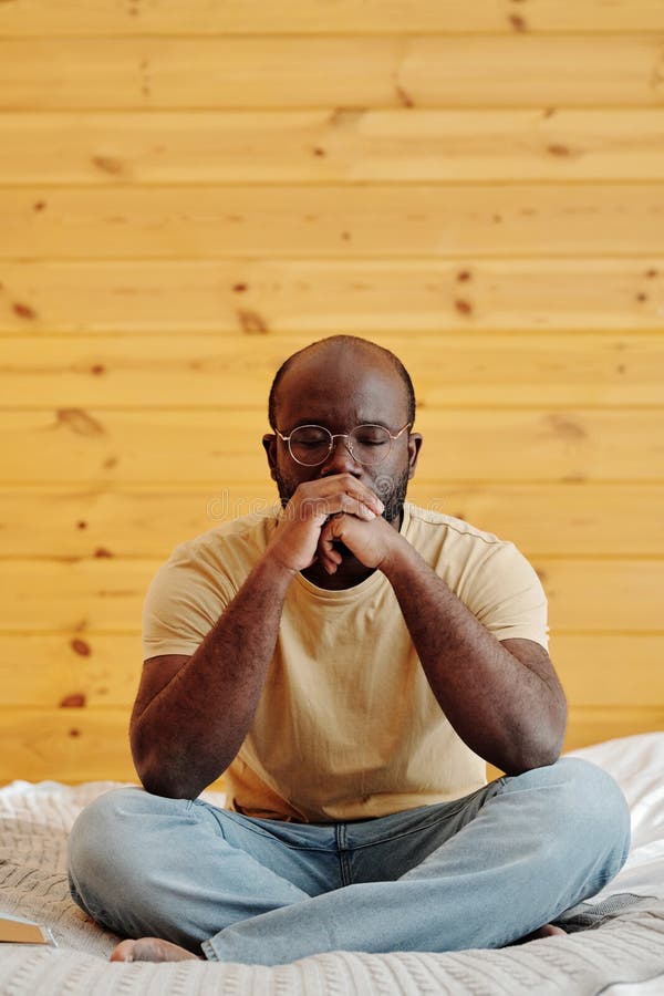 Young Thoughtful African American Man Sitting on Bed Stock Image ...