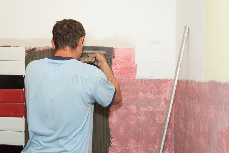 Young Man Tiling on Balkony Ceramic Tiles Stock Photo - Image of tool ...