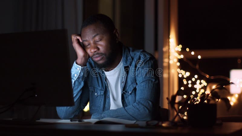 Young Tired African American Guy Working on Computer Late in Evening ...