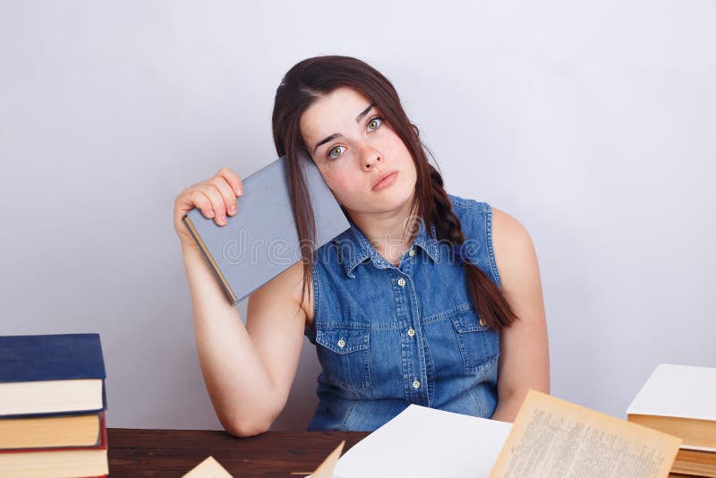 Young Tired Bored Student Woman Sitting at the Table with Book Stock ...