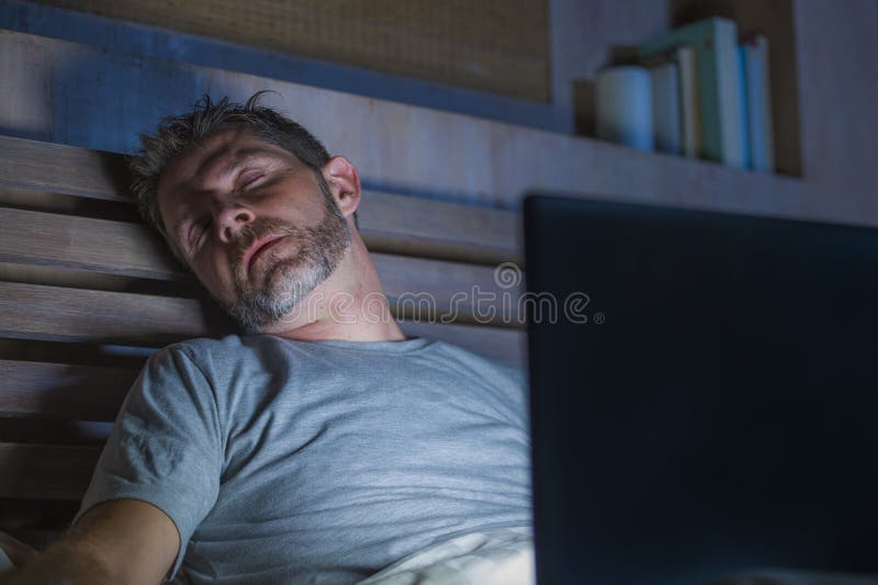 Young Tired and Exhausted Internet or Work Addict Man Sleeping while ...