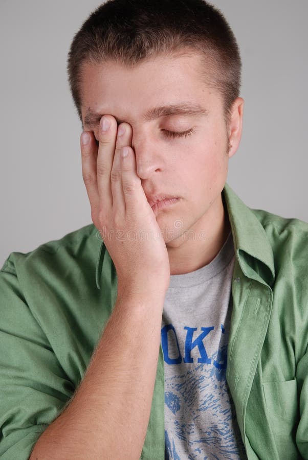Young Tired Man, Clothing His Face with His Hand Stock Photo - Image of ...