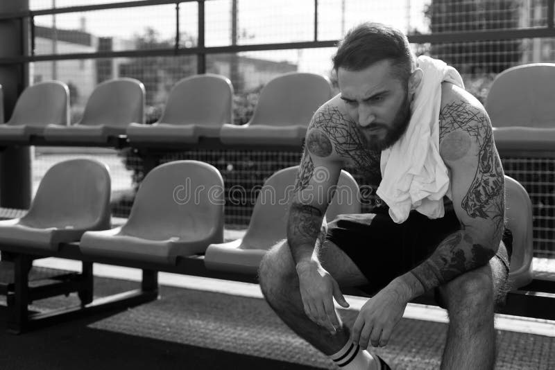 Young Tired Man Resting, Sitting after Training Stock Photo - Image of ...
