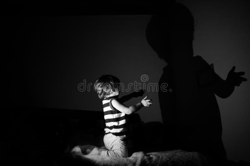Young Toddler Boy Playing with His Shadow. Stock Photo - Image of smile ...