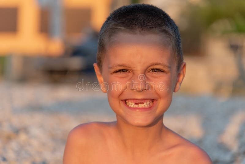 Young Toothless Boy Smiling Stock Photo - Image of green, toothless ...