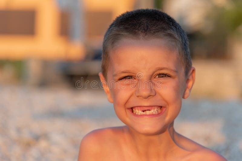 Young Toothless Boy at the Beach Stock Photo - Image of caucasian ...