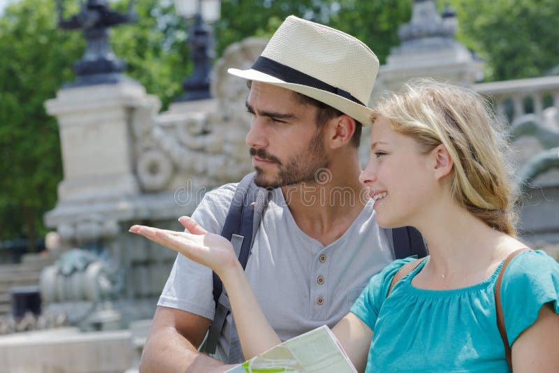 Young Tourist Couple Looking for Attractions on Map Stock Photo - Image ...