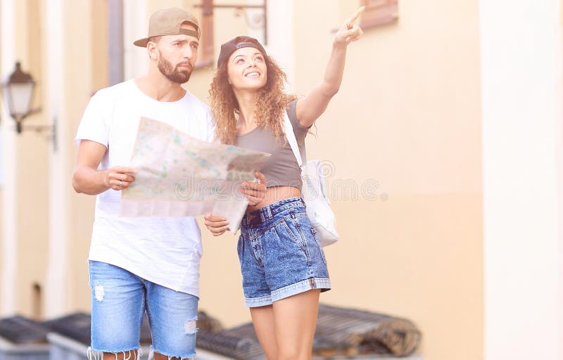 Young Tourist Couple with Map Looking for a Way Stock Photo - Image of ...