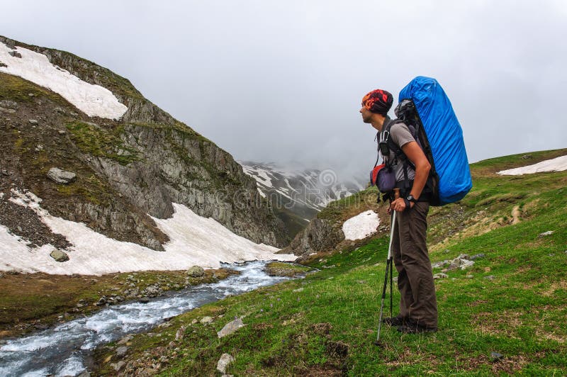 Young Tourist Resting on Top Overlooking the Valley Stock Photo - Image ...