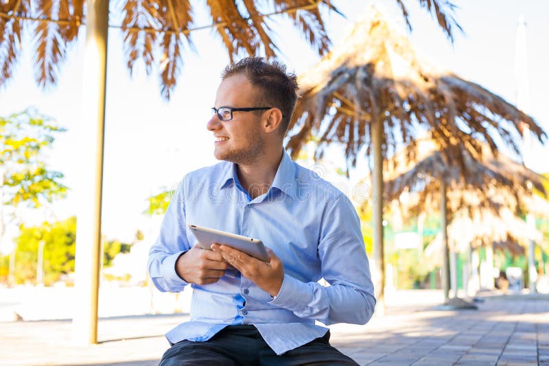 Young Tourist Under Palm Tree with Mobile Tablet Pc. Positive Em Stock ...