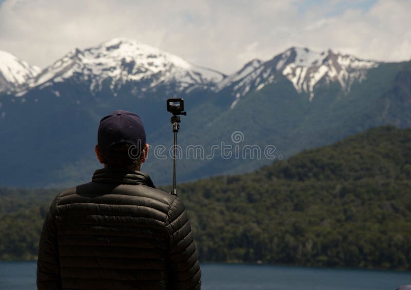 Young Tourist Using a Handheld Camera Stick To Capture Stunning Views ...