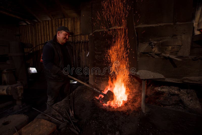 Young Traditional Blacksmith Working with Open Fire Stock Photo - Image ...